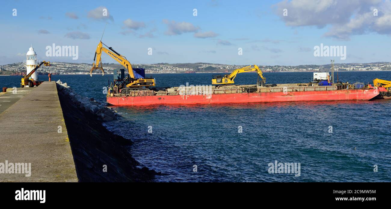 Work being carried out to strengthen Brixham breakwater with rock ...