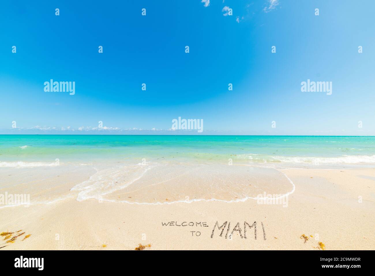 Welcome to Miami written on world famous Miami Beach shore. Southern ...