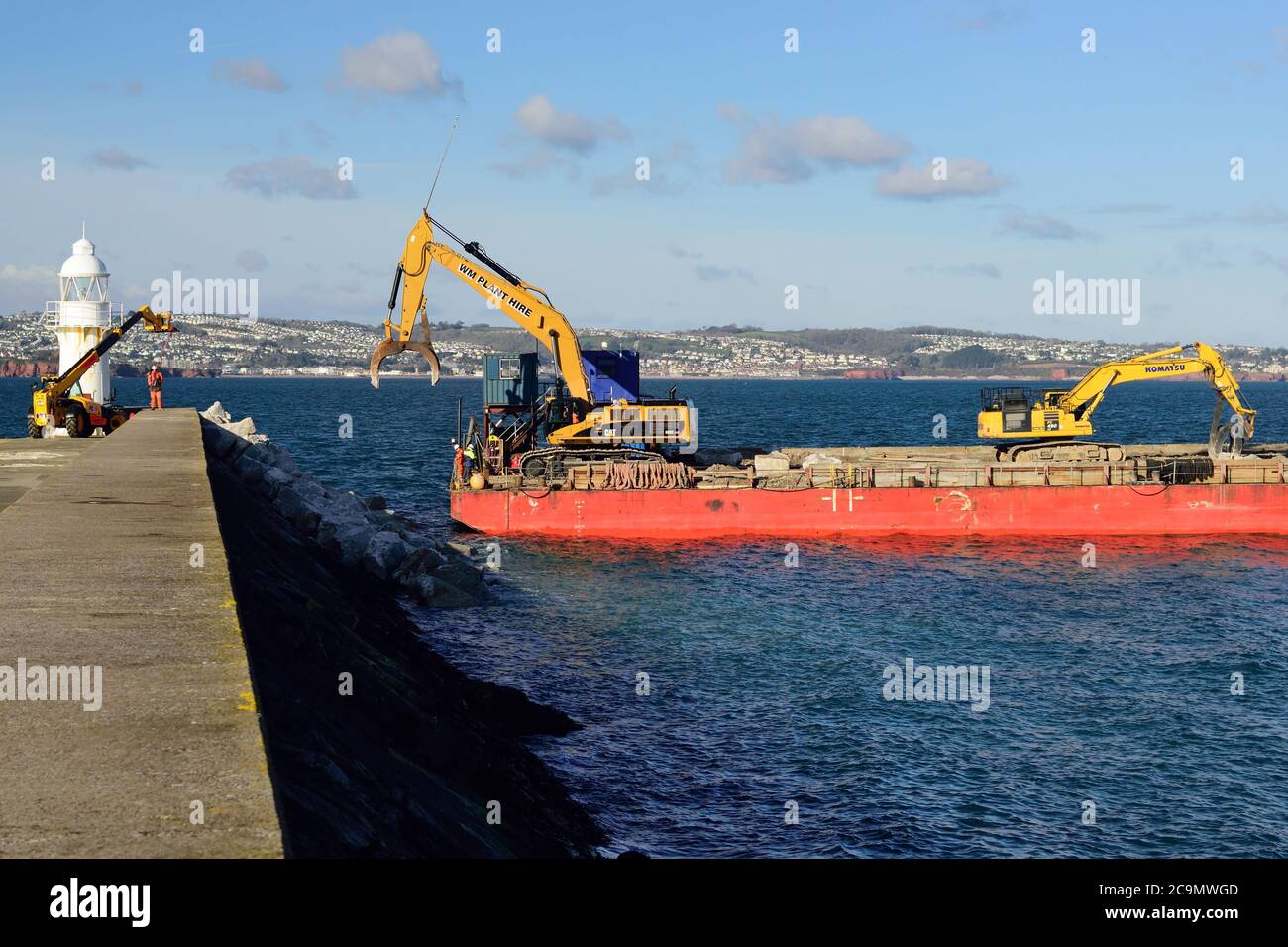 Work being carried out to strengthen Brixham breakwater with rock ...