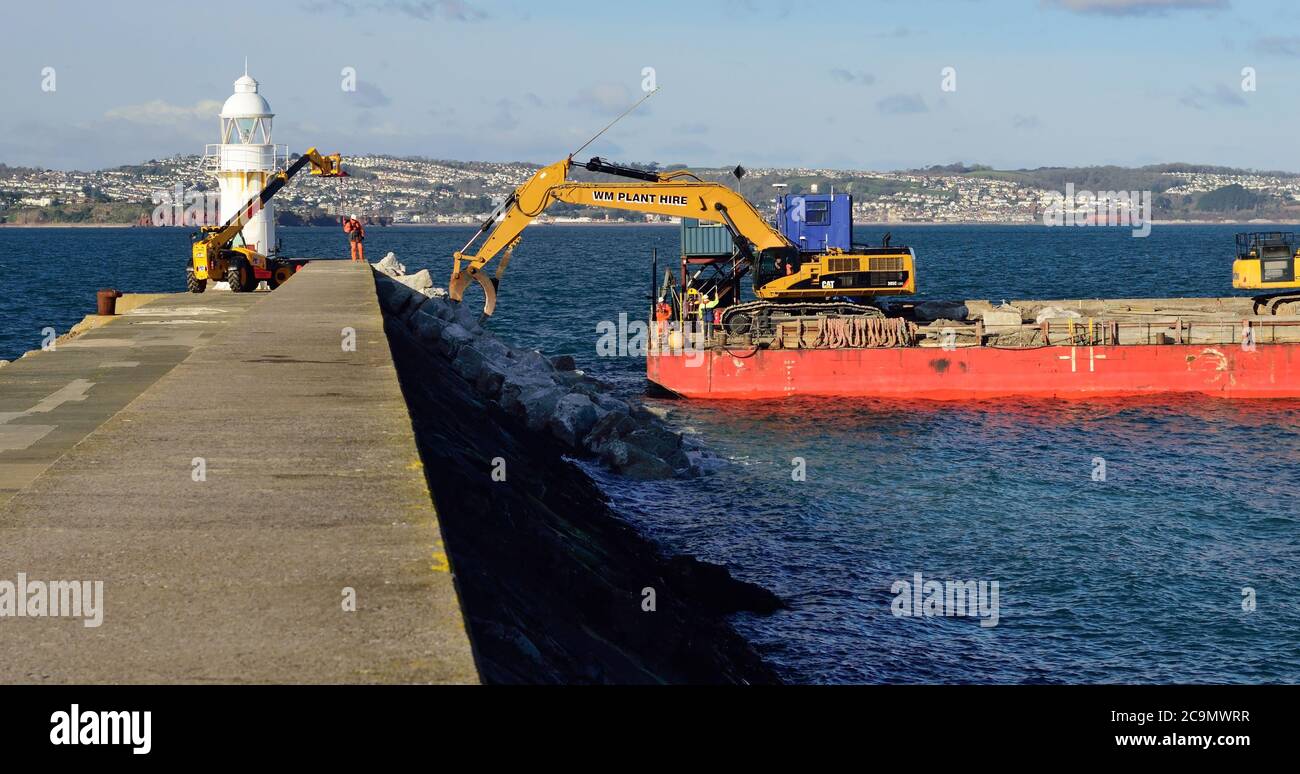 Work being carried out to strengthen Brixham breakwater with rock ...