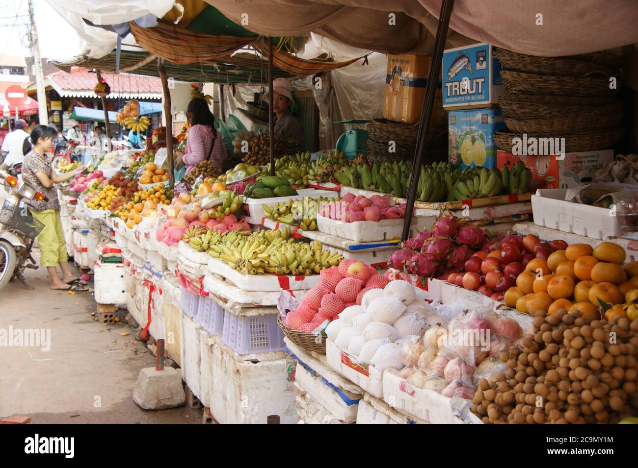 Fruit stalls in Asia supply a variety of local and imported produce ...