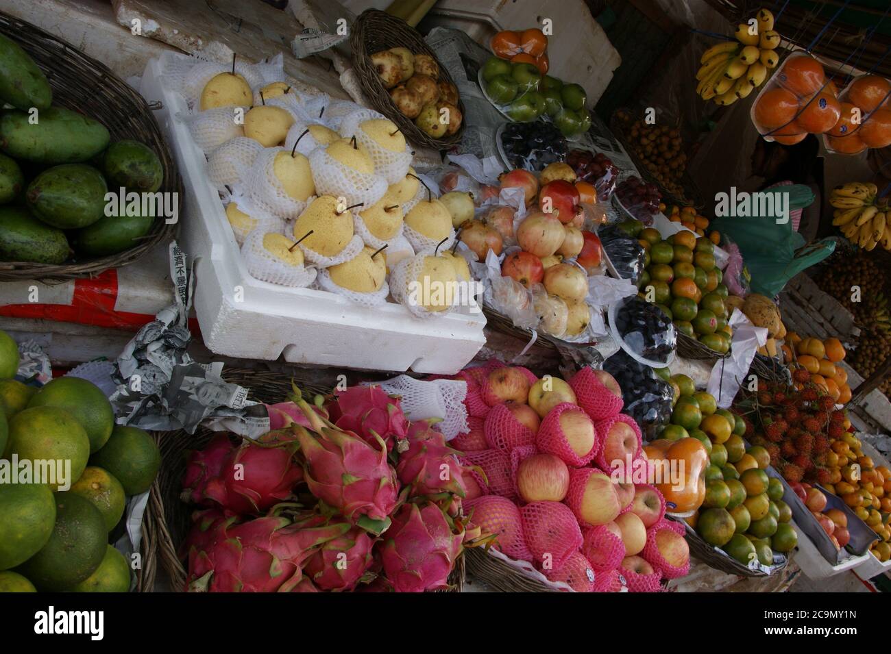 Fruit stalls in Asia supply a variety of local and imported produce ...