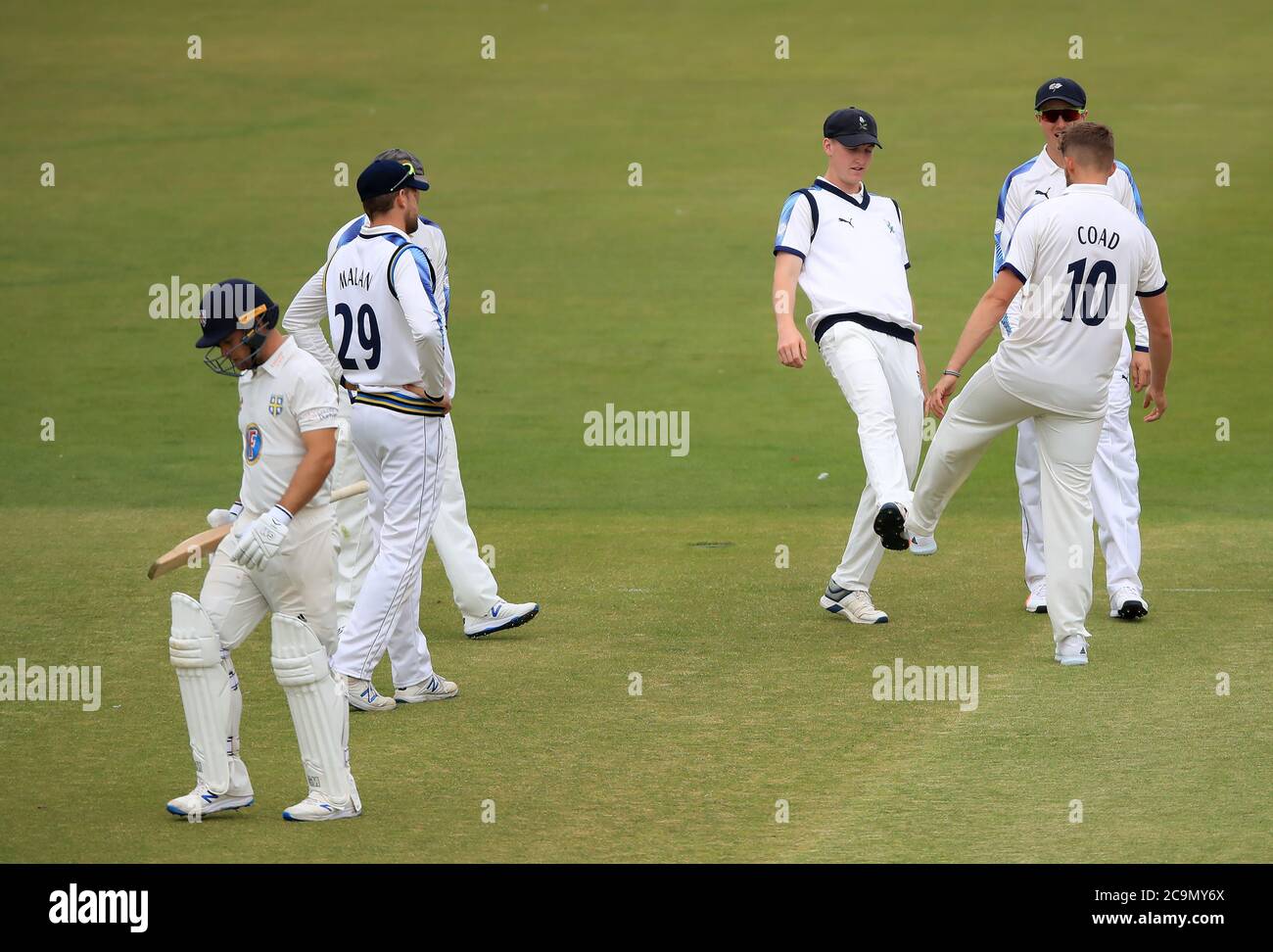 Yorkshire's Ben Coad (right) celebrates taking the wicket of Durham's ...