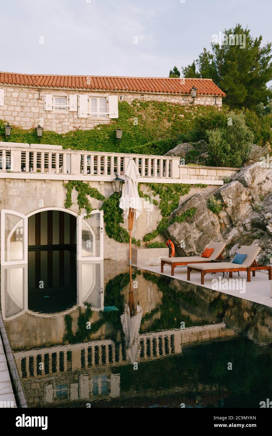 Mirror reflection in the swimming pool in the old villa Stock Photo - Alamy