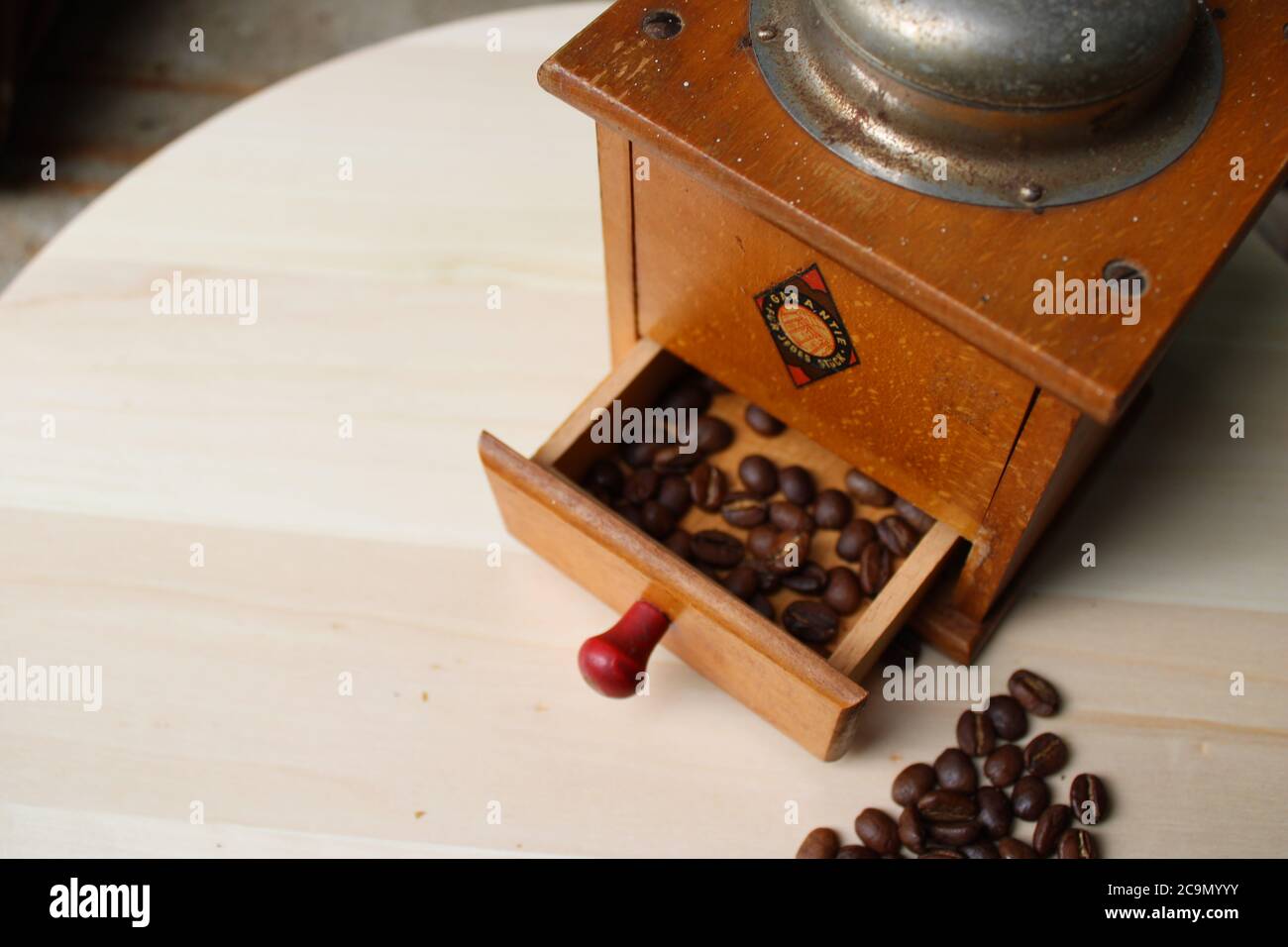 Antique German coffee grinder with whole beans in its open drawer Stock ...