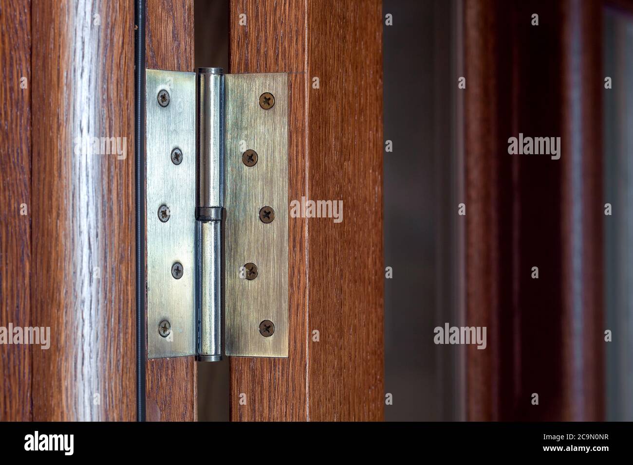 door hinge, metal door loop established on a wooden door close up Stock ...