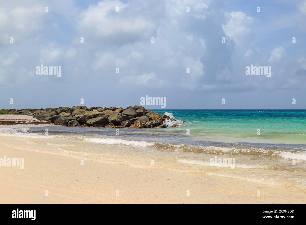A photograph of rocks on a beach, on the caribbean island of Barbados ...