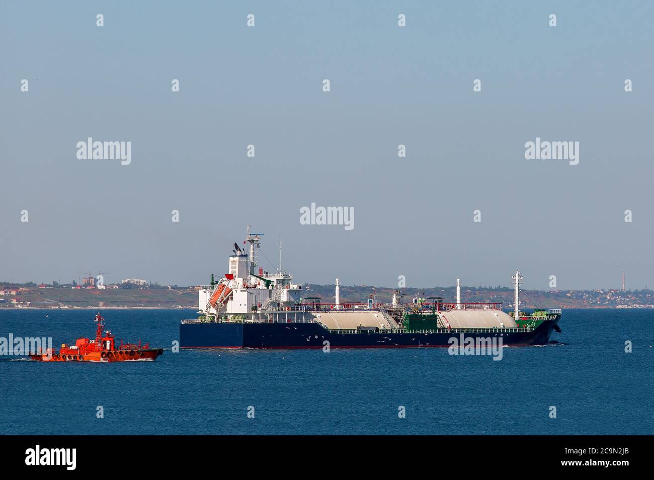 The lng ship, gas carrier vessel coming into the sea port Stock Photo ...