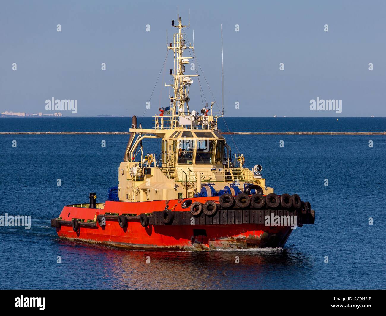 tugboat on maneuvers at sea Stock Photo - Alamy