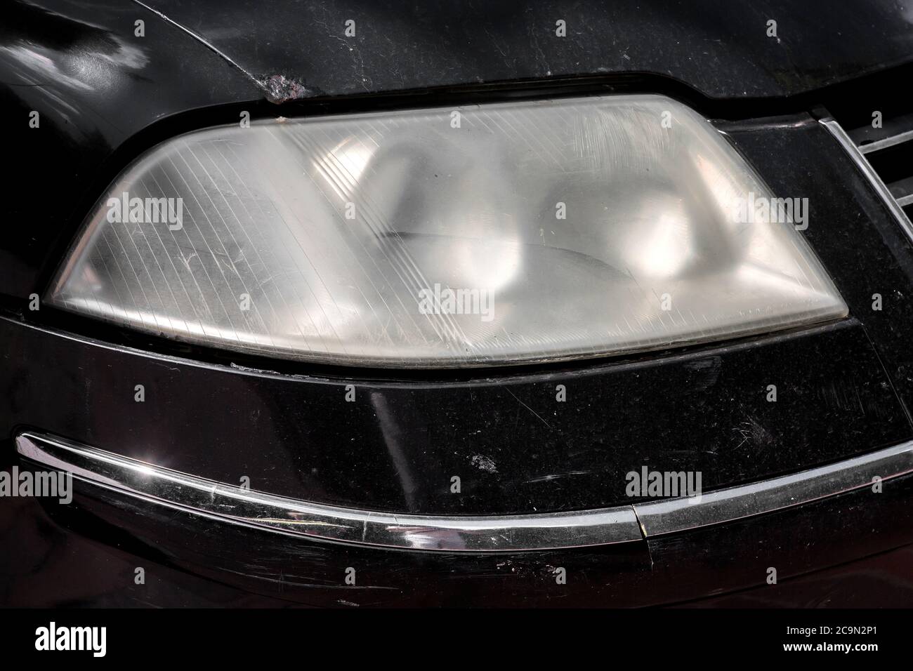 headlight car unpolished misted over from within Stock Photo - Alamy