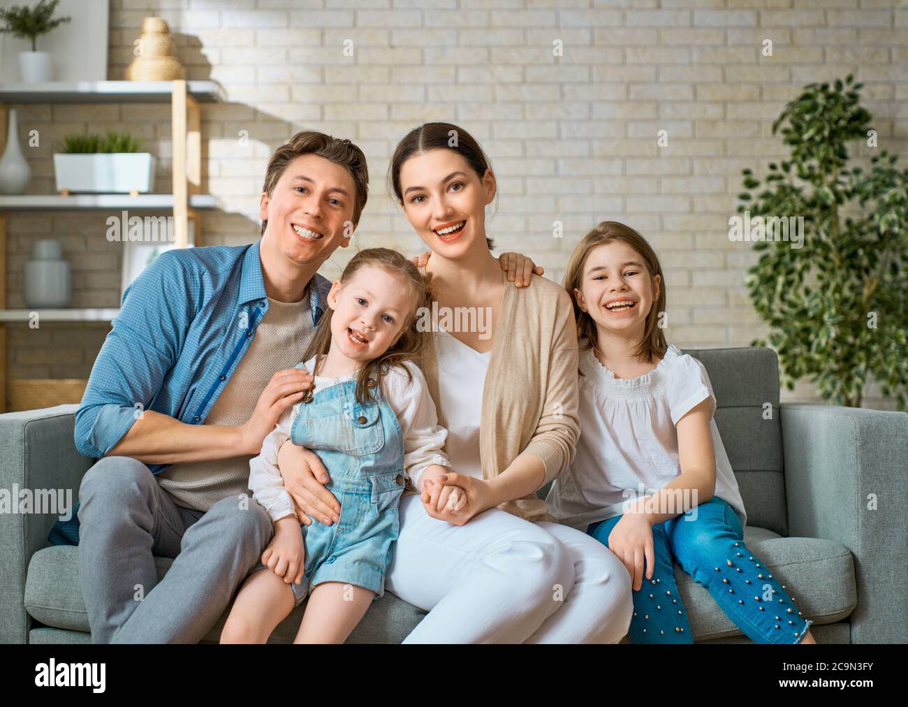 Happy family! Two children daughters with mother and father. Mum, dad ...