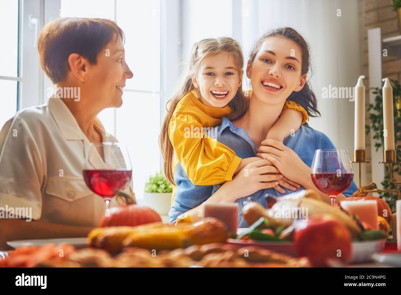 Happy Thanksgiving Day! Autumn feast. Family sitting at the table and ...