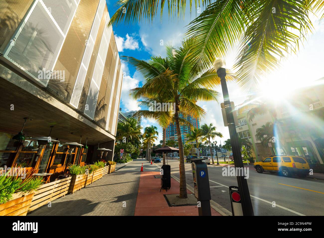 Sun shining over a beautiful street in Miami Beach. Southern Florida ...