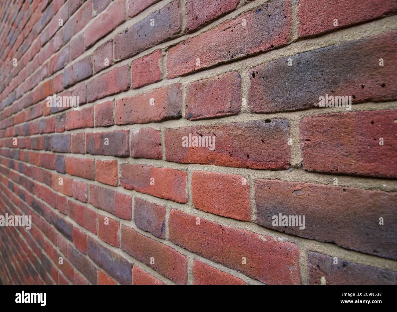 View of new brick wall taken geometrically leading to vanishing point ...