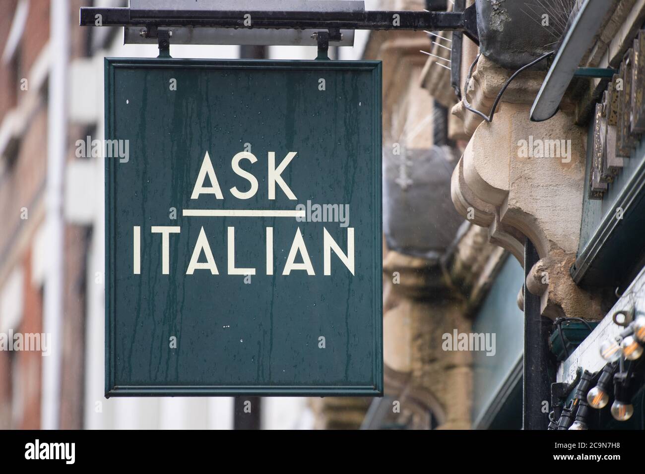 A close-up of an Ask Italian restaurant sign in Cardiff, Wales, United ...