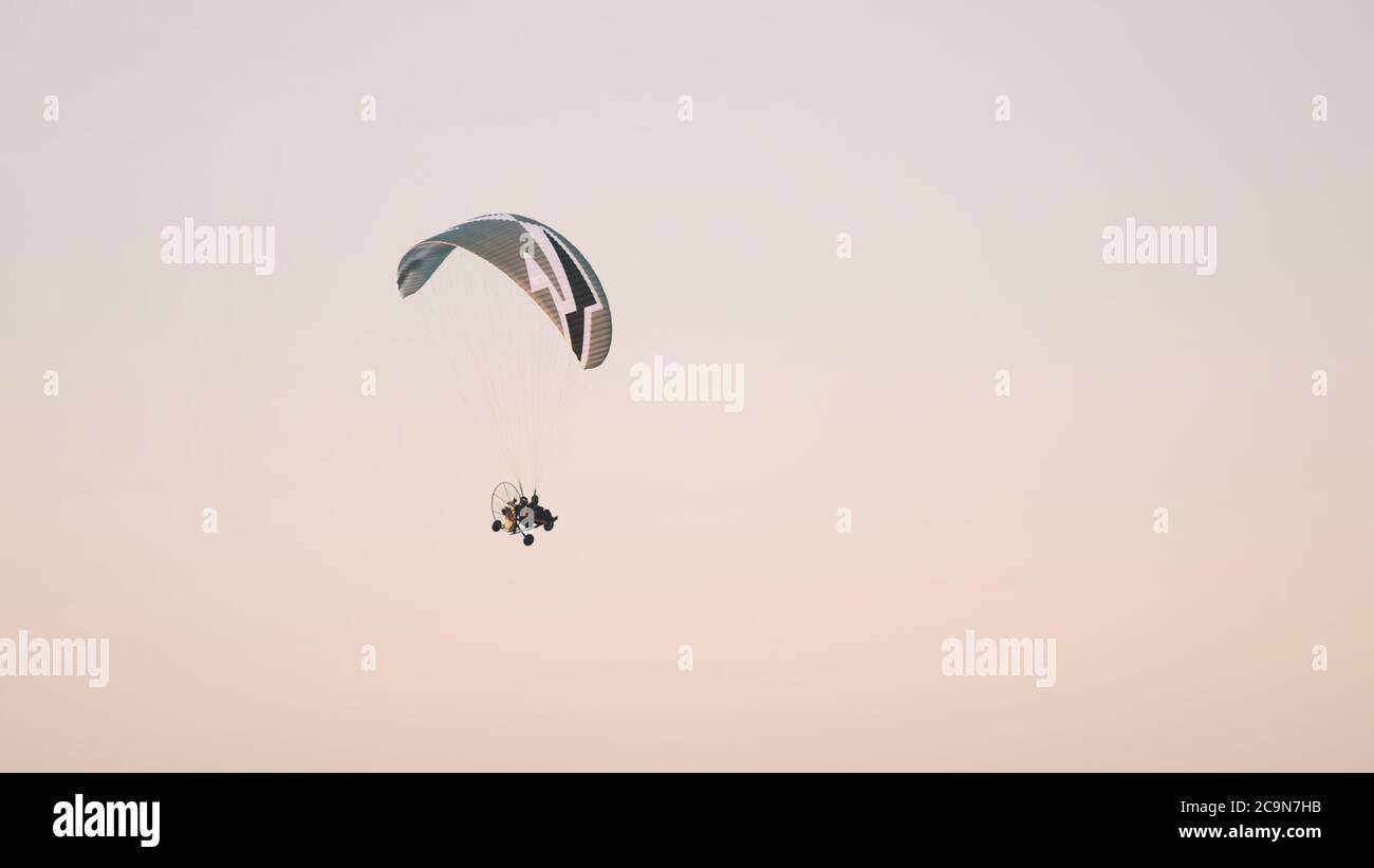 Paramotor Tandem Gliding And Flying In The Air. Copy space. High ...