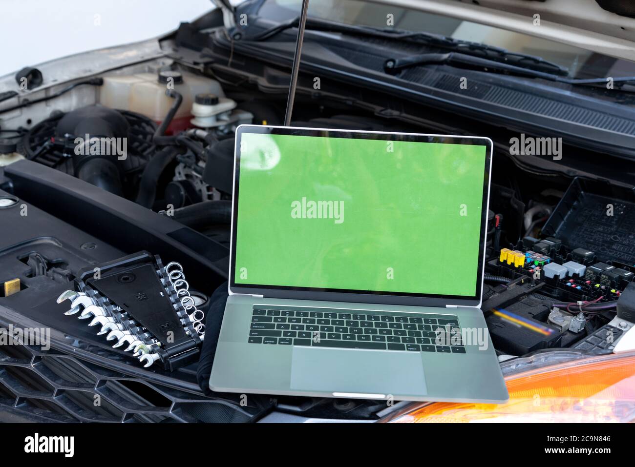 Laptop on hood of car hi-res stock photography and images - Alamy