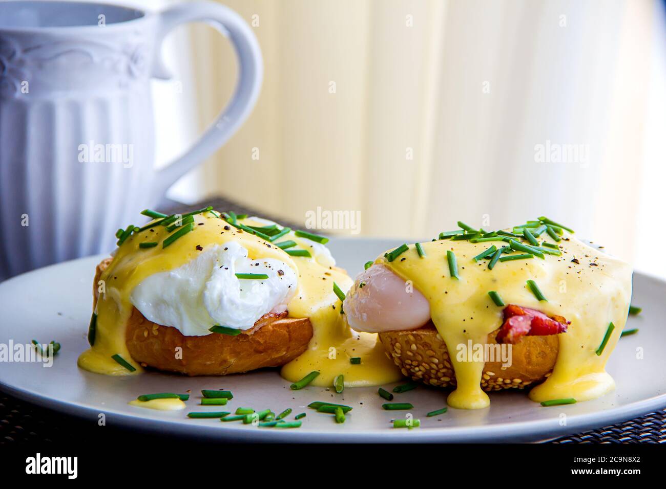 Eggs Benedict- toasted muffins, ham, poached eggs, delicious buttery ...