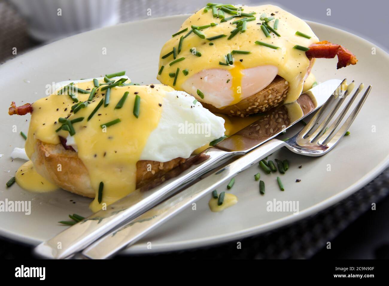 Eggs Benedict- toasted muffins, ham, poached eggs, delicious buttery ...