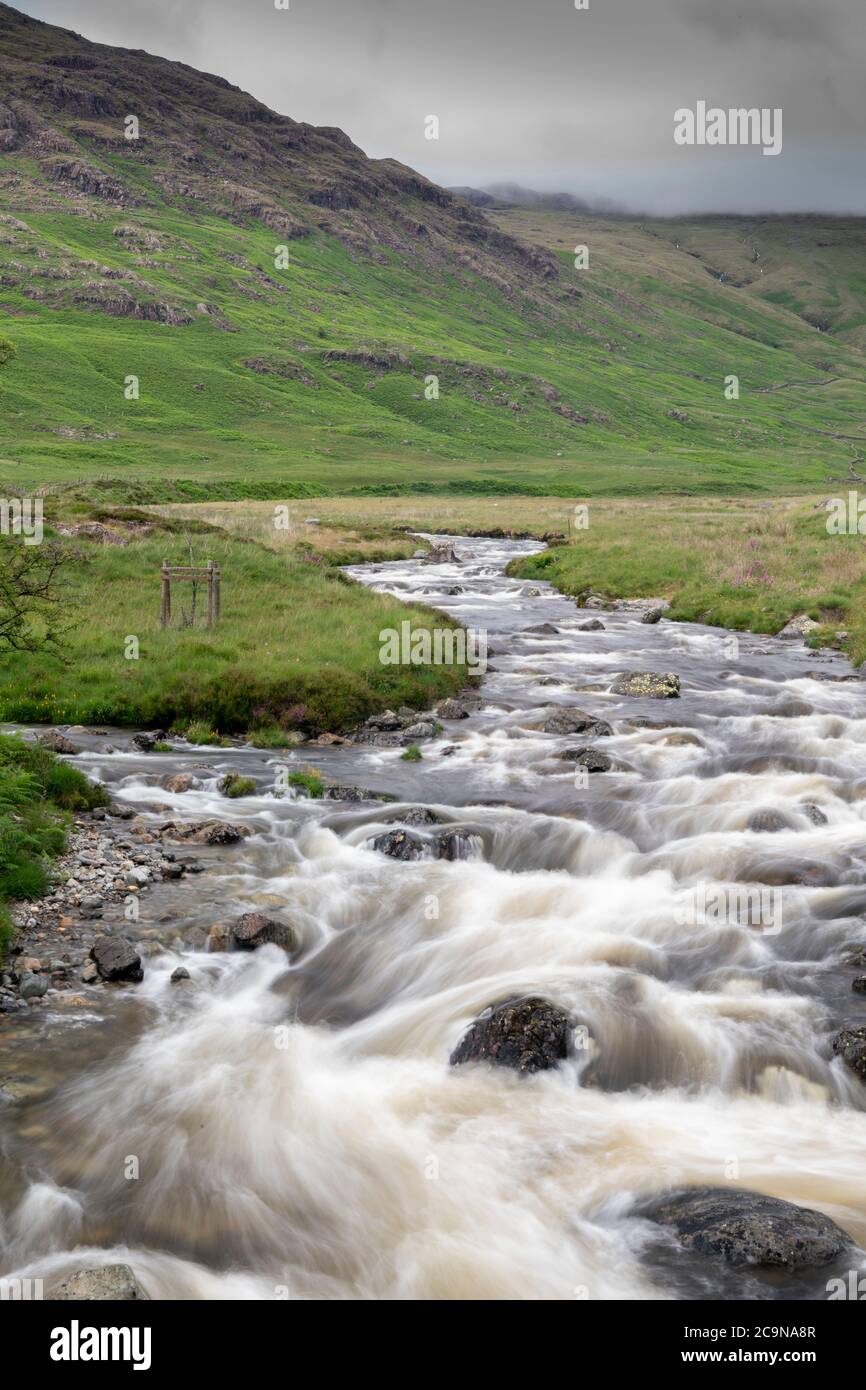 The River Duddon at Cockley Beck bridge in summer. Lake District ...