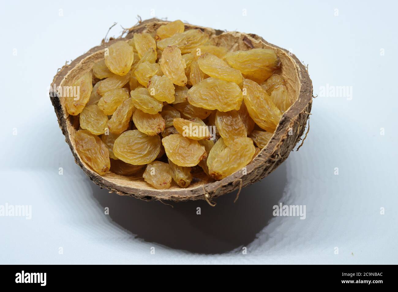 Dried grapes are yellow isolated on white background Stock Photo - Alamy