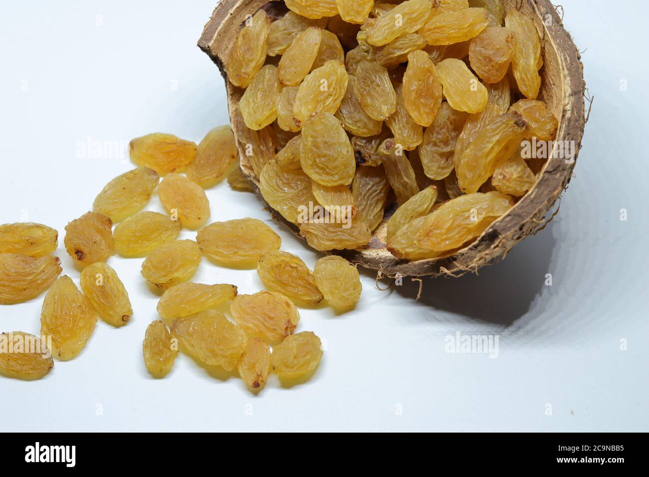 Dried grapes are yellow isolated on white background Stock Photo - Alamy