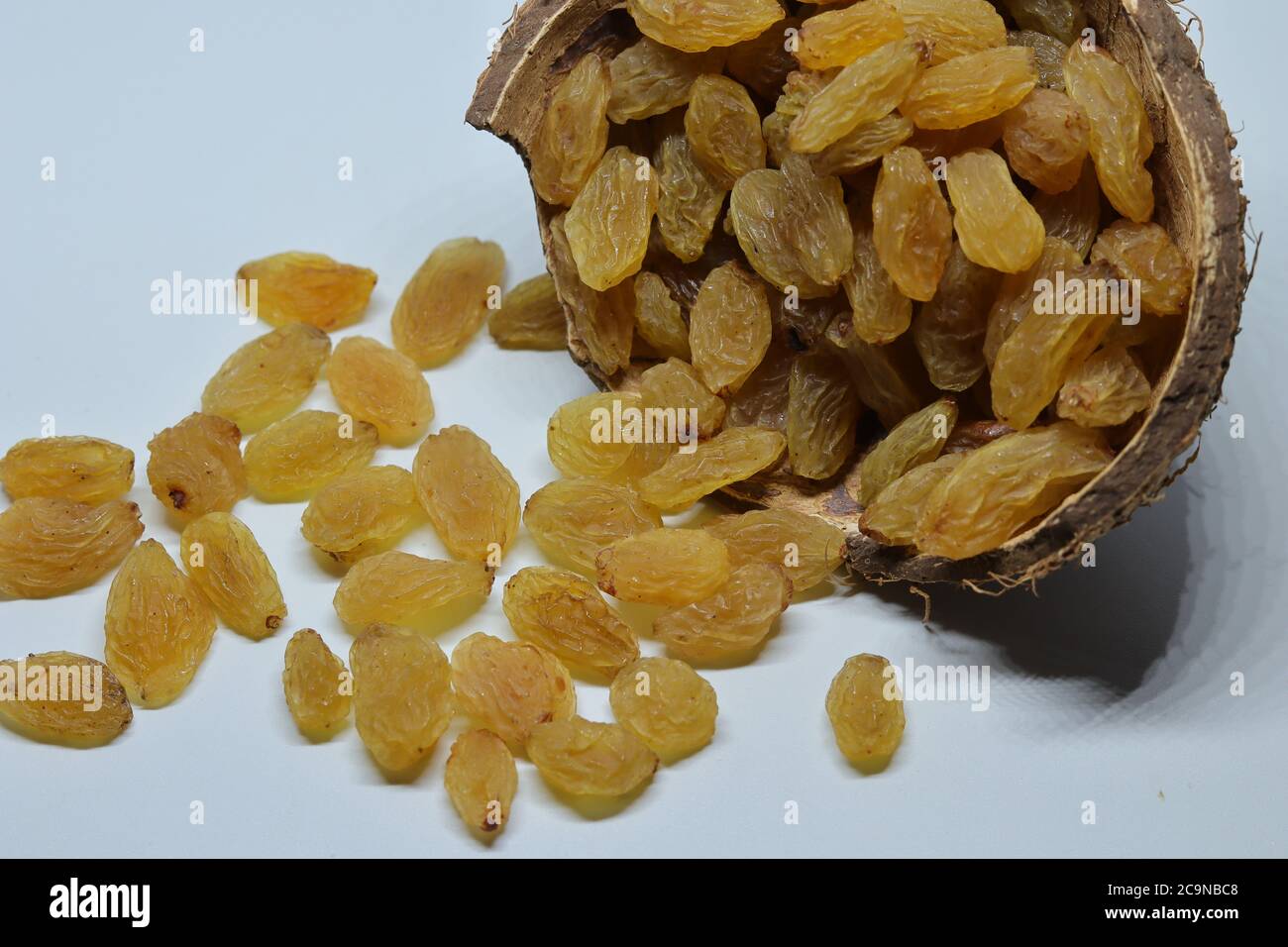 Dried grapes are yellow isolated on white background Stock Photo - Alamy