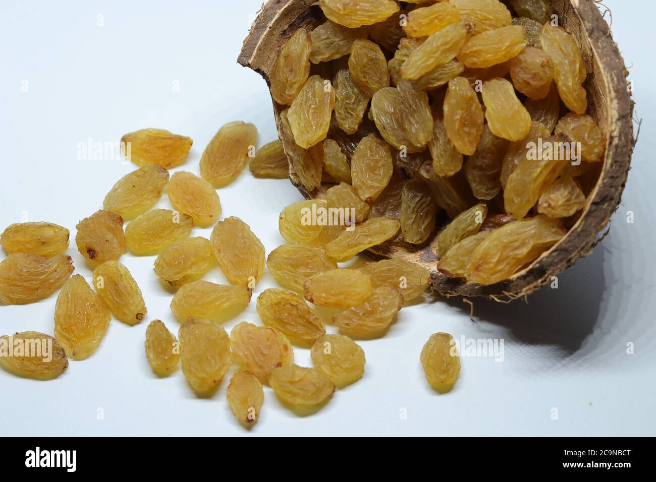 Dried grapes are yellow isolated on white background Stock Photo - Alamy