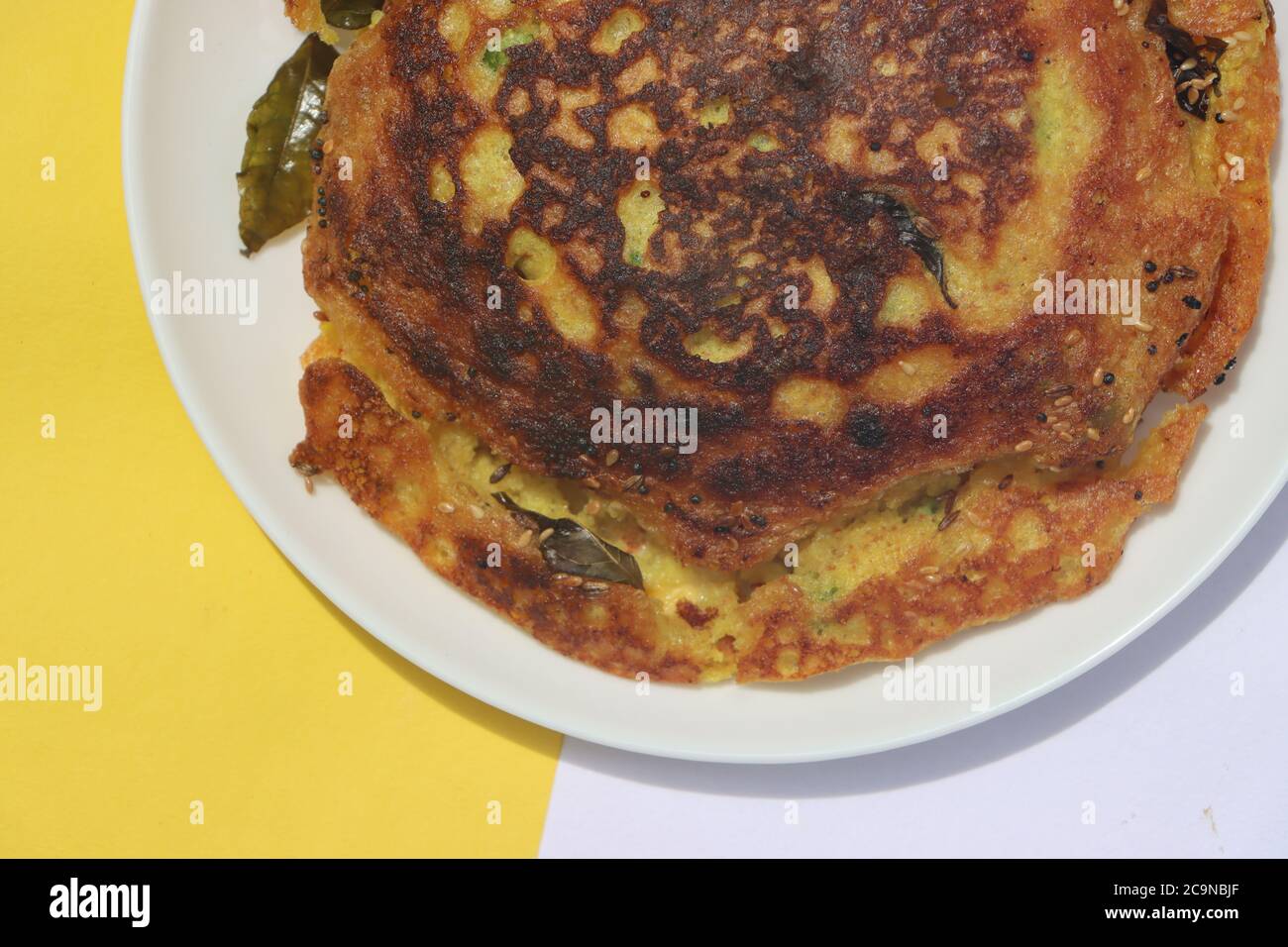 Handwa or Handvo - Gujarati snack cake with rice, lentil and spices ...