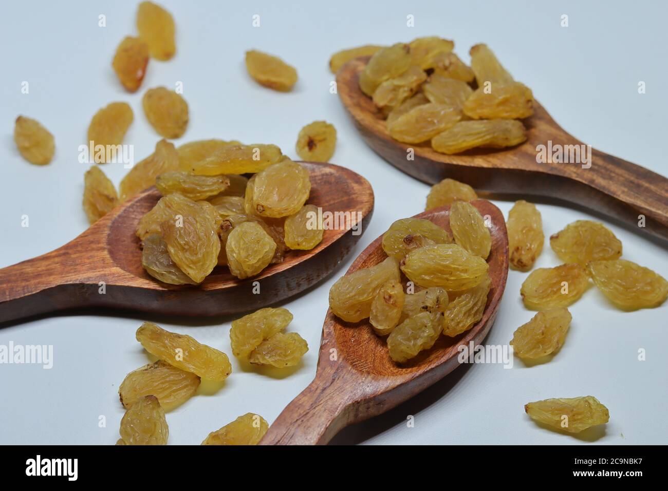 Dried grapes are yellow isolated on white background Stock Photo - Alamy