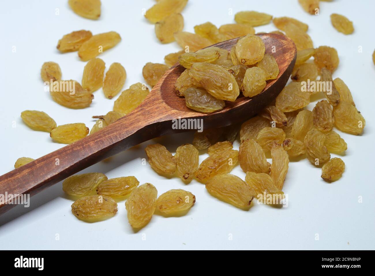 Dried grapes are yellow isolated on white background Stock Photo - Alamy