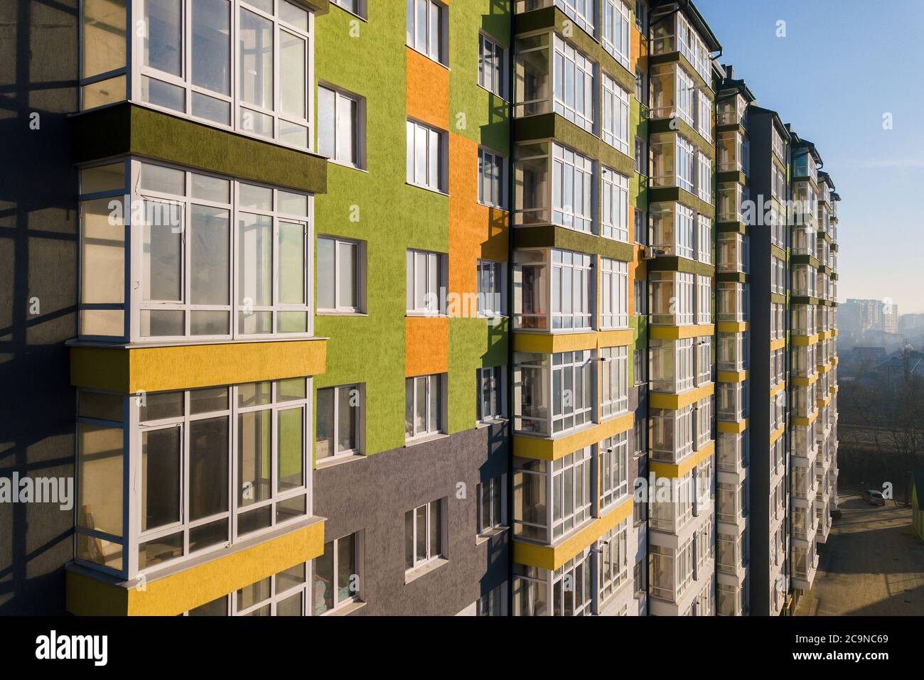Aerial view of a tall residential apartment building with many windows ...