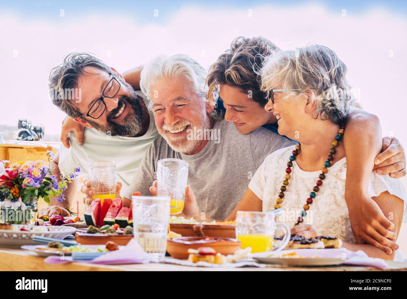Son hug with senior man hi-res stock photography and images - Alamy
