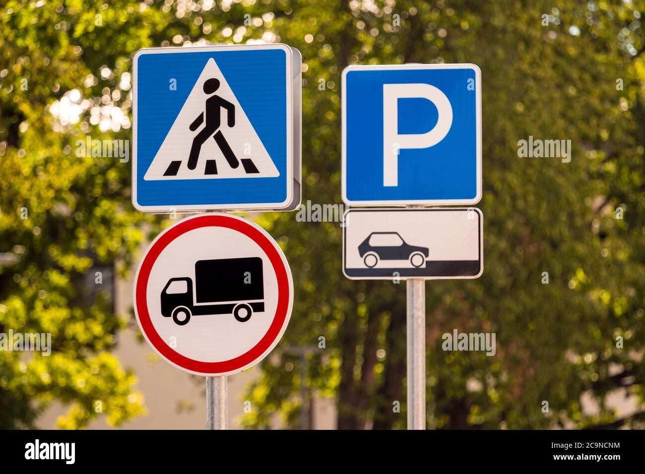 Traffic signs: pedestrian crossing, no goods vehicles, car parking ...