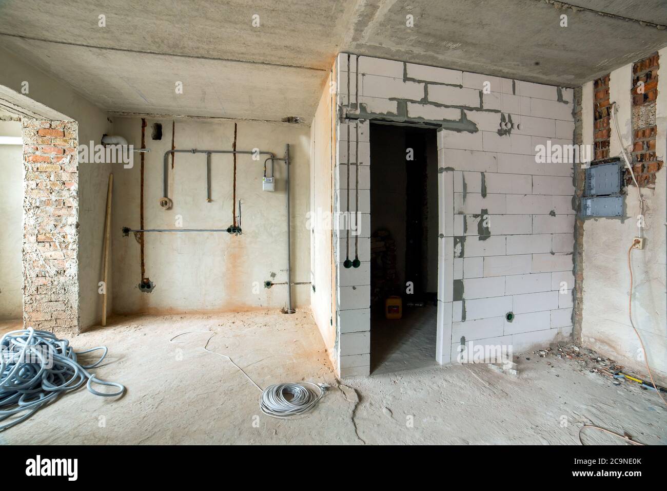 Interior of an apartment room with bare walls and ceiling under ...