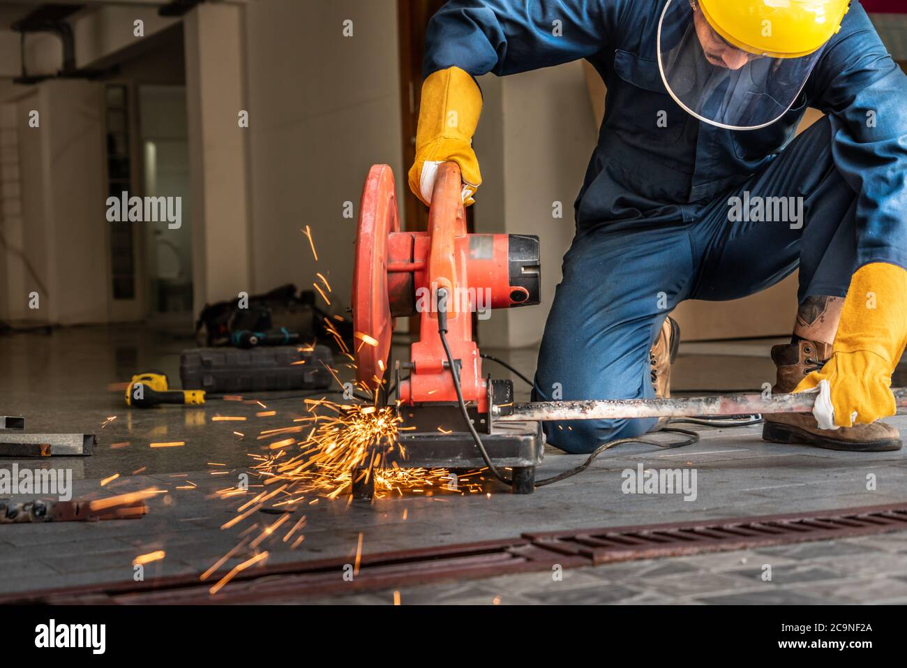 Professional mechanic is cutting steel metal Stock Photo - Alamy