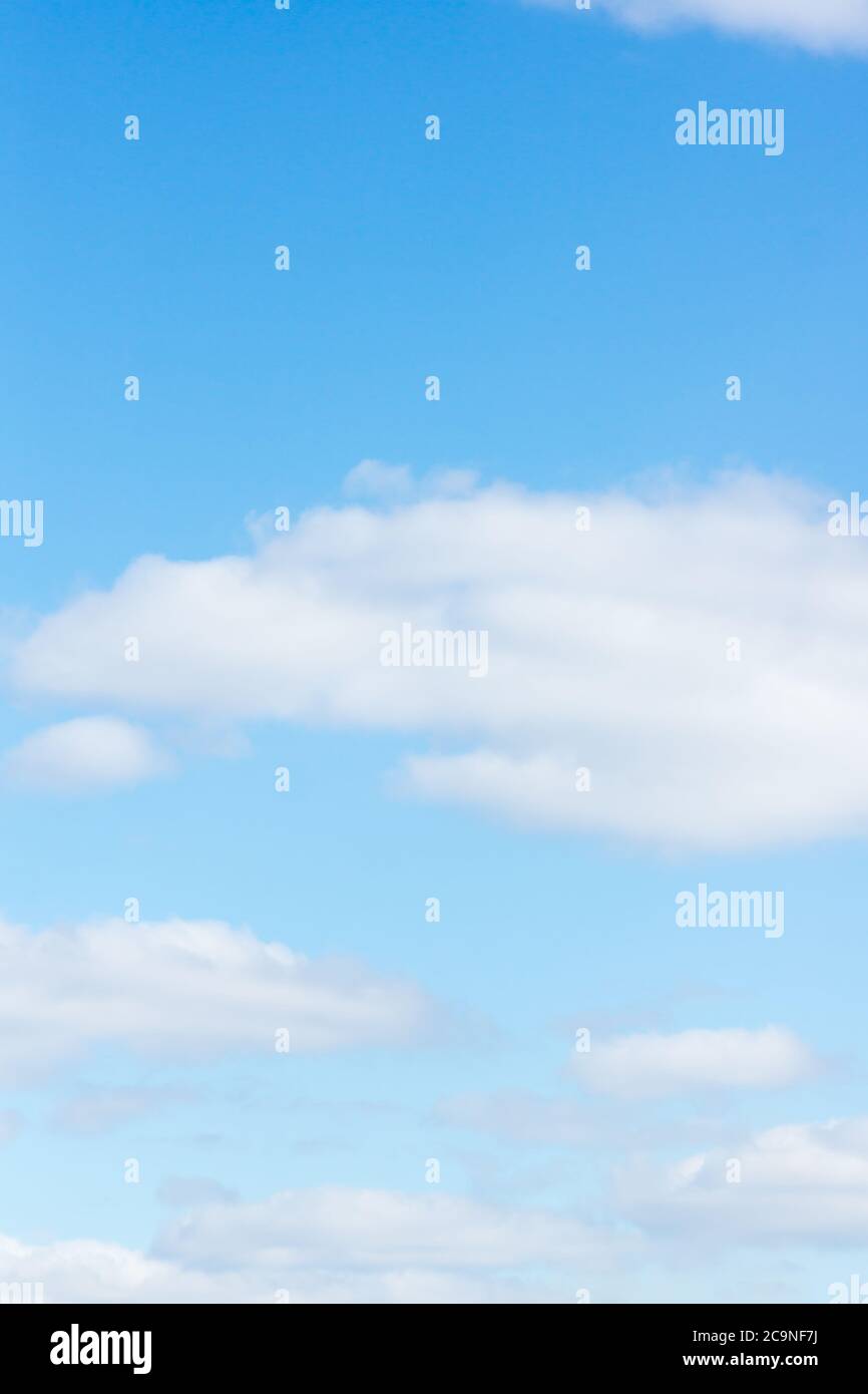 blue sky with flying white light clouds Stock Photo - Alamy