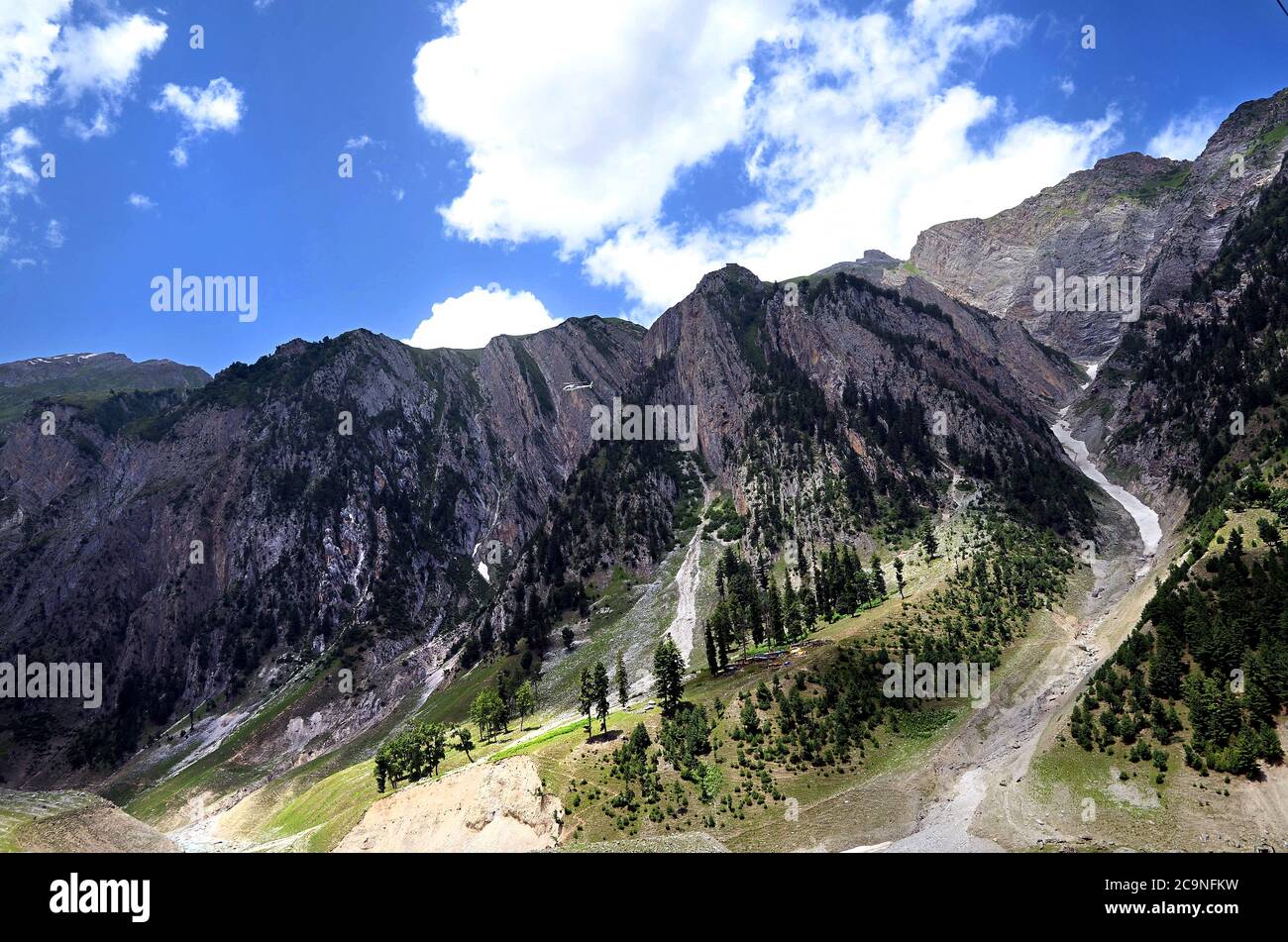 Hindu devotees visit during their pilgrimage from Baltal Base Camp to ...