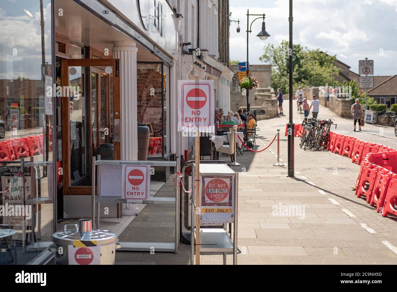 Multiple No Entry signs seen at the entrance to a DIY store. Both ...
