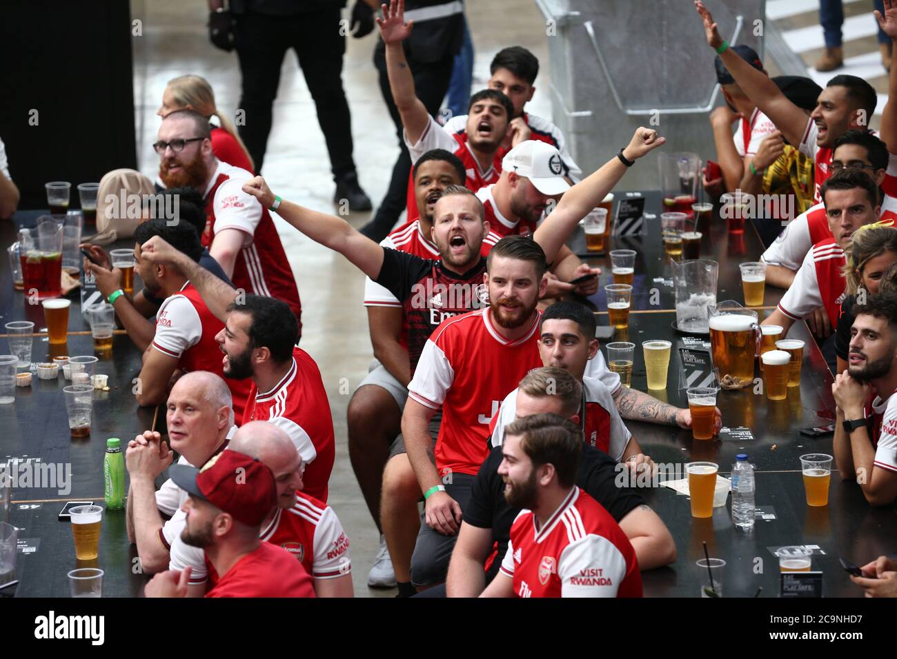 Fans cheer at Box Park Wembley in London, as they watch the FA Cup ...