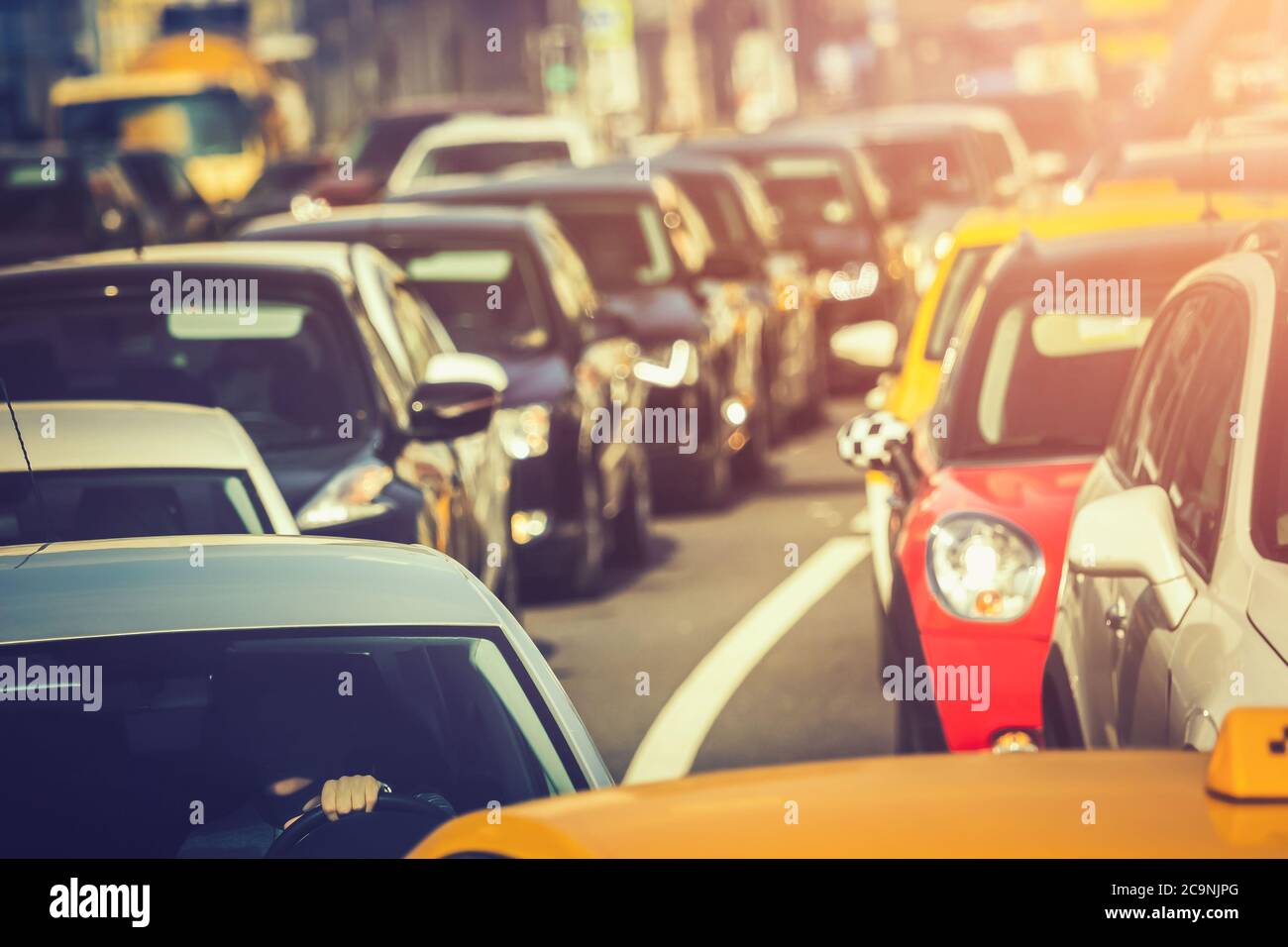 Cars standing in a queue during rush hour Stock Photo - Alamy
