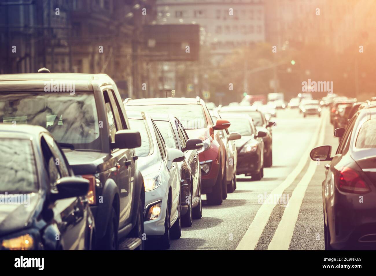 Cars standing in a line during traffic jam at sunset Stock Photo - Alamy