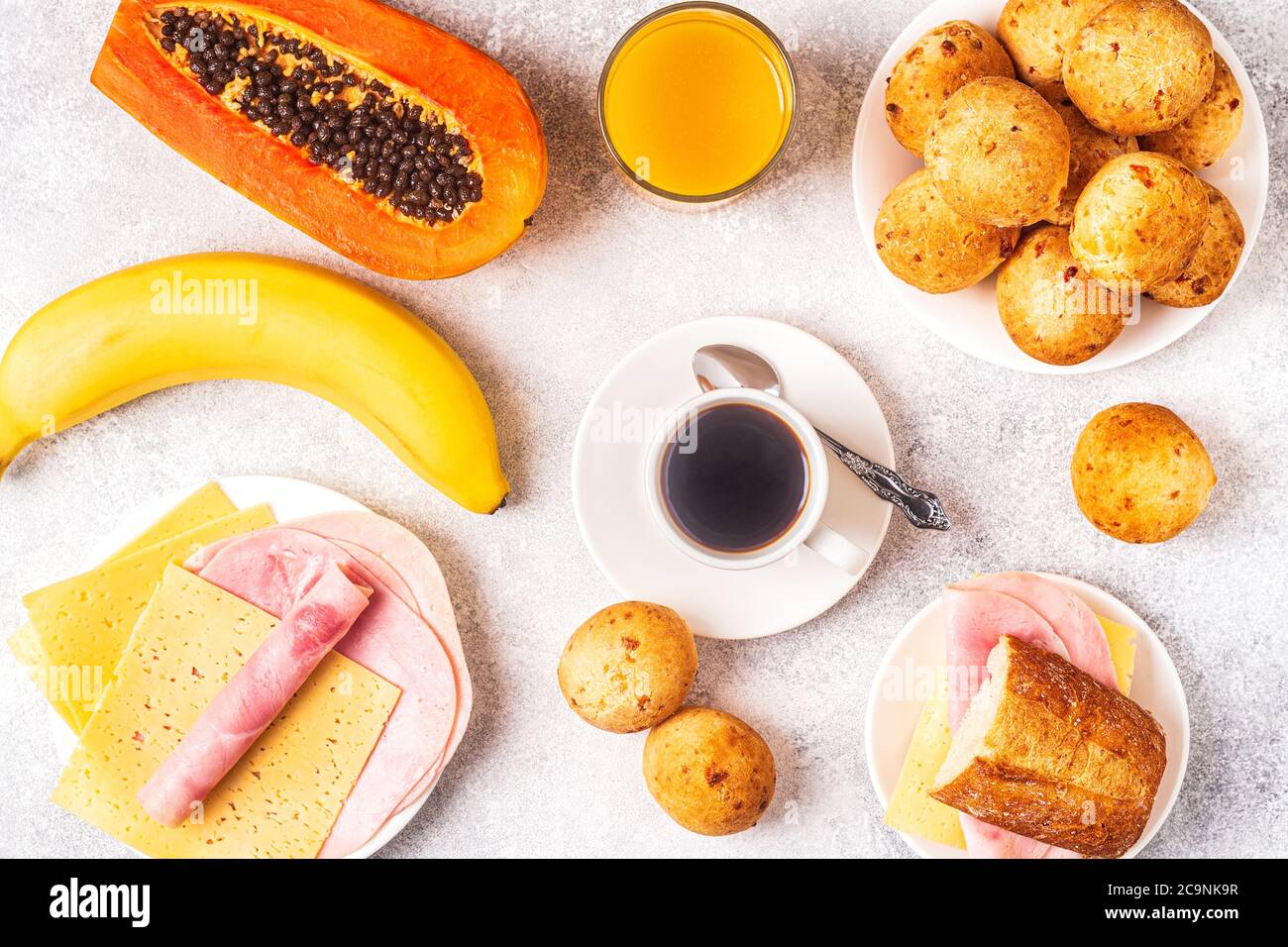 Traditional Brazilian breakfast - cheese bread, coffee, ripe fruit, top ...