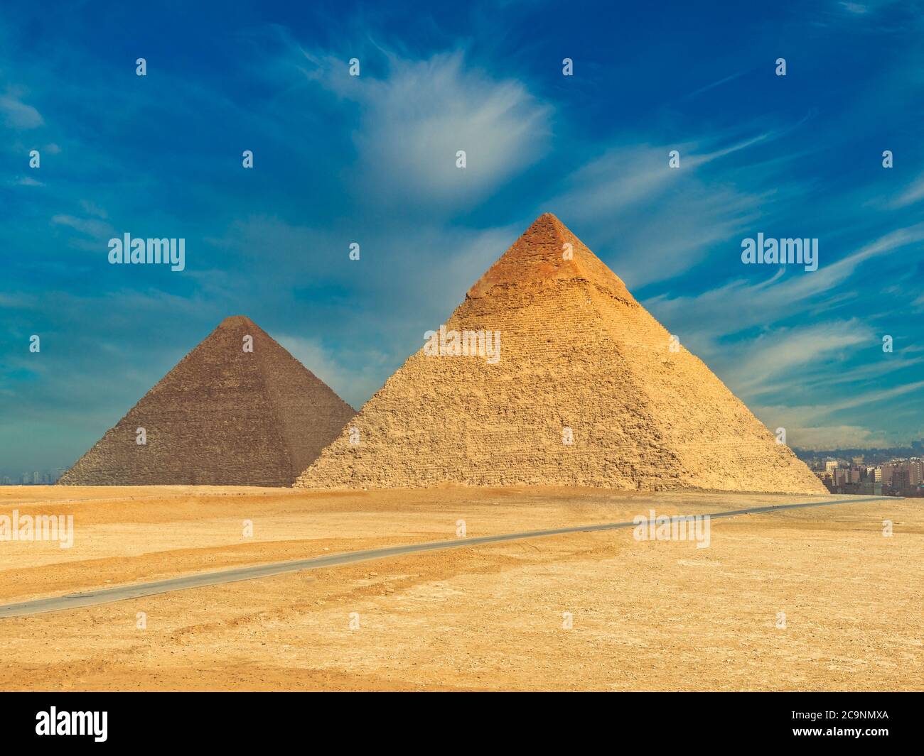 The famous pyramids at Giza in Egypt with a blue sky Stock Photo - Alamy