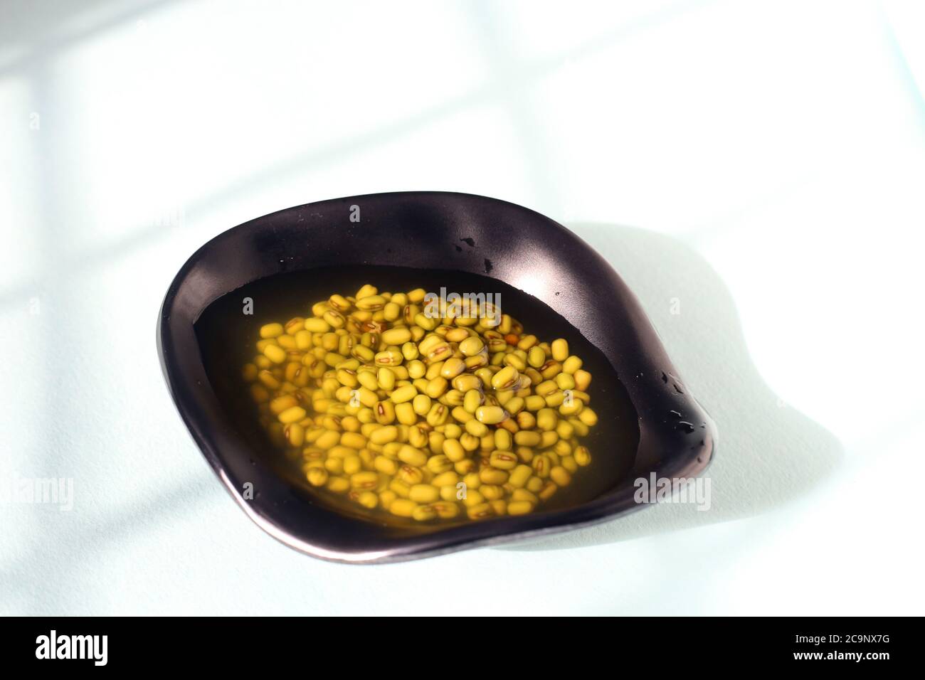 Healthy soaked green gram, Green gram in a black bowl on isolated ...