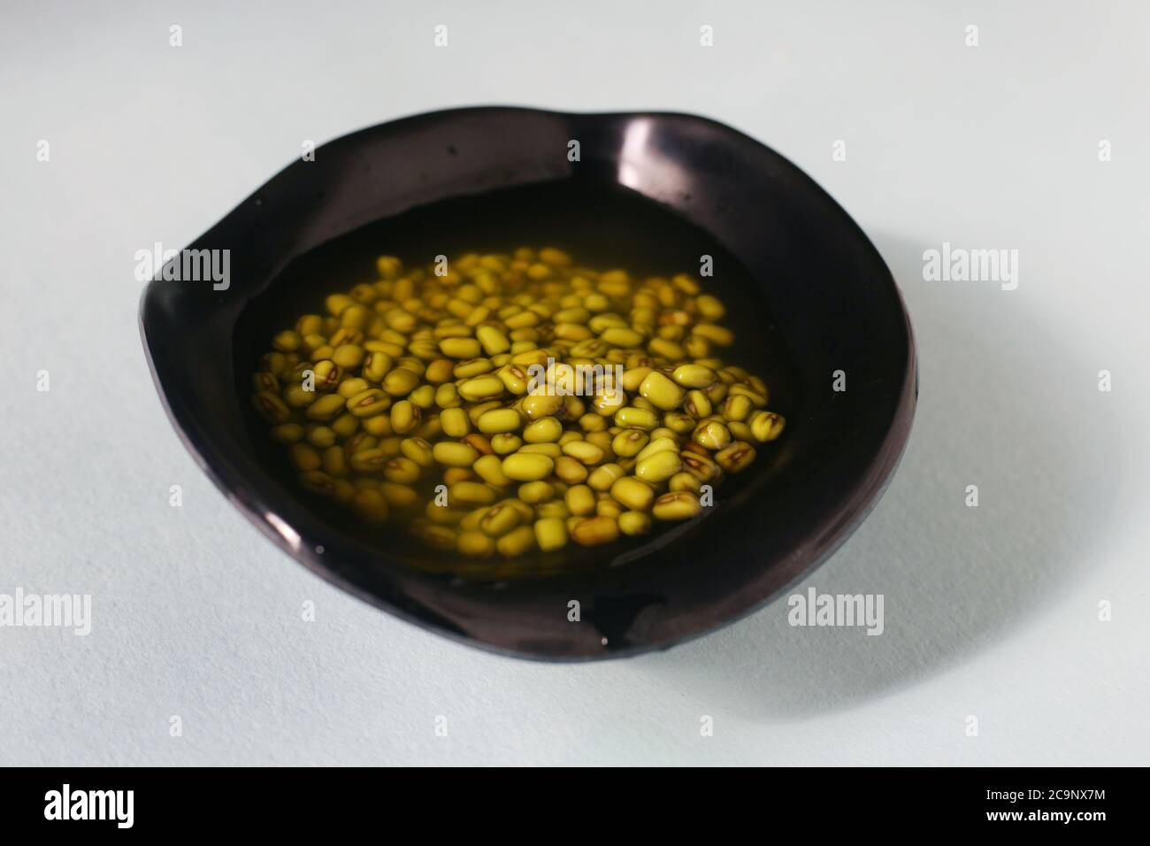 Healthy soaked green gram, Green gram in a black bowl on isolated ...