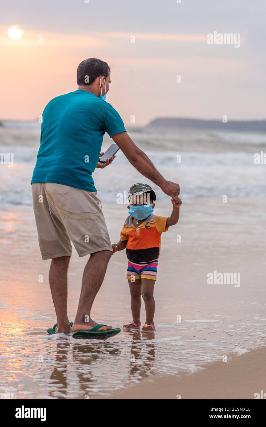 Indian family goa beach playing hi-res stock photography and images - Alamy
