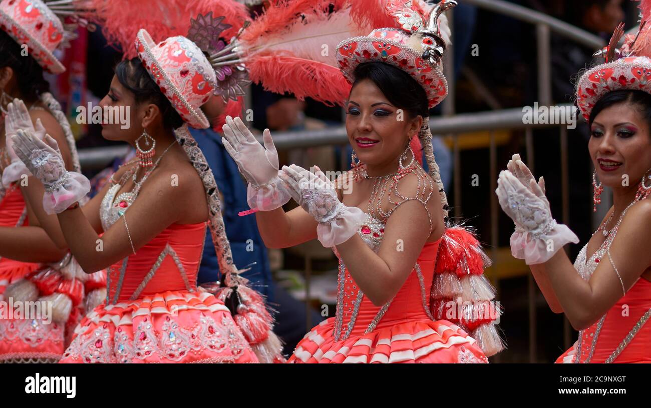 Morenada dancers in ornate costumes parade through the mining city of ...