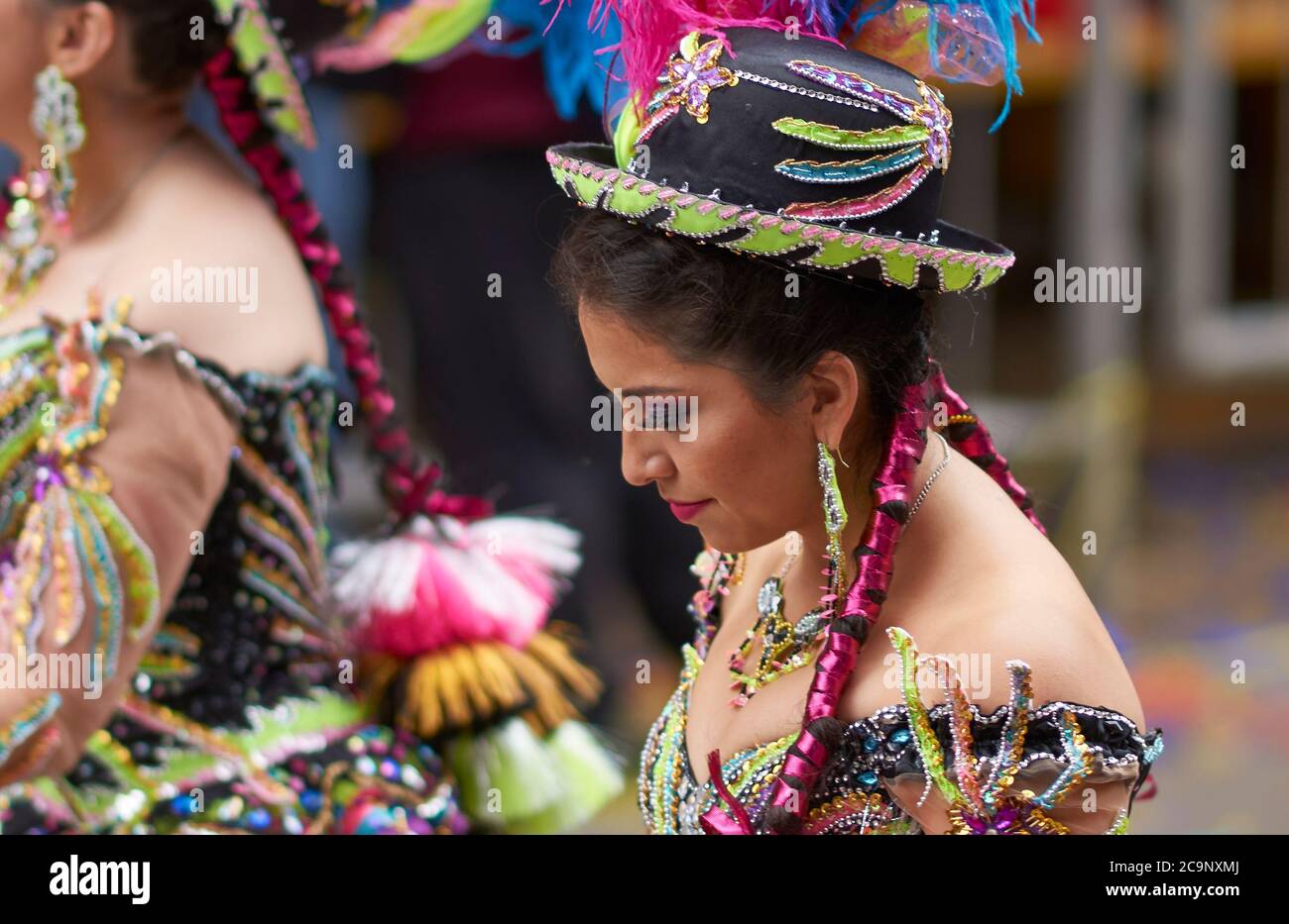 Morenada dancers in ornate costumes parade through the mining city of ...
