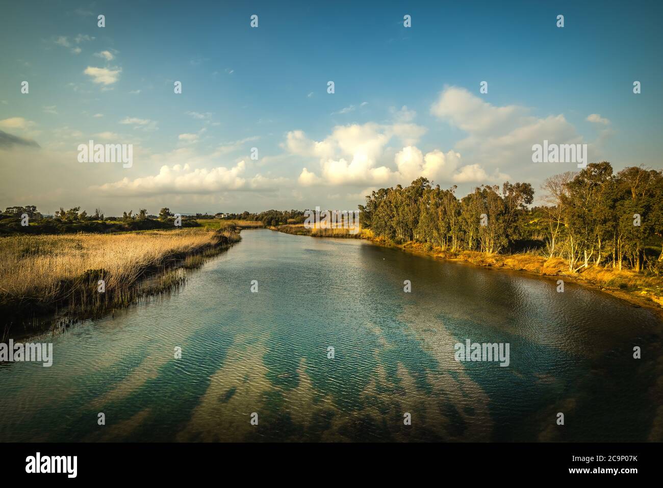 Cloudy sky over Calik lagoon at sunset. Sardinia, Italy Stock Photo - Alamy